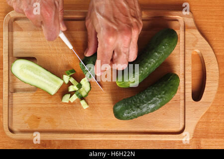 Dicing cucumber. Directly Above Stock Photo - Alamy