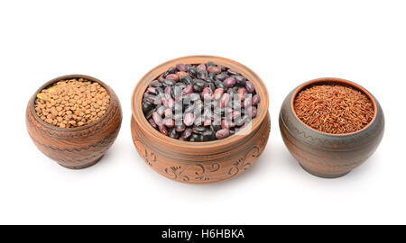 Assortment of beans in pots and wooden spoons on gray background Stock ...