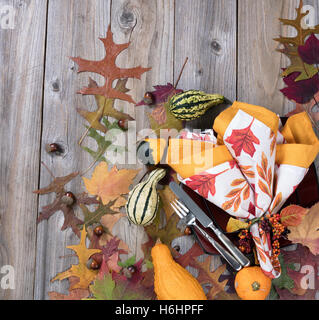 Autumn table setting with acorns on yellow background Stock Photo - Alamy