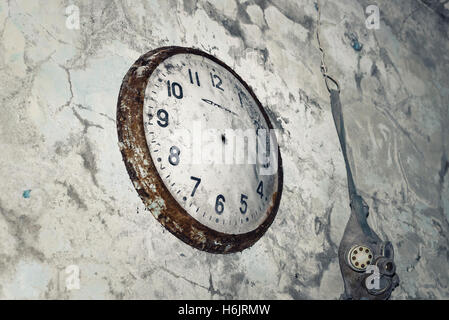 The old clock hanging in abandoned building of Chernobyl Stock Photo ...