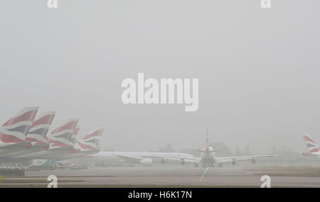 Planes in the fog at Heathrow Airport, London Stock Photo - Alamy