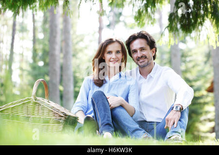 Beautiful young happy woman with basket of clean laundry at home Stock ...