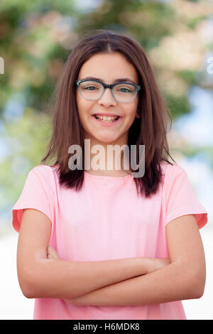 Pretty preteenager girl twelve years old with glasses outside Stock ...