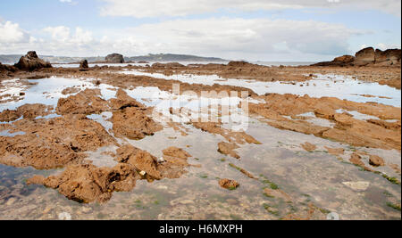 Natural water puddle on the rocky beach of Chrissi island. Beautiful ...
