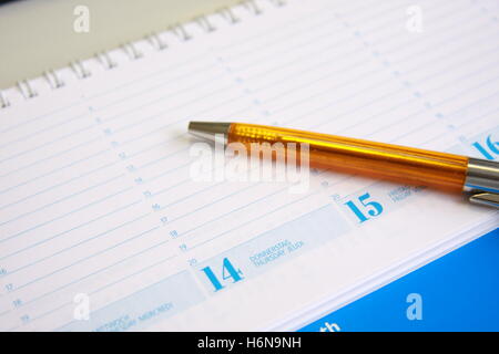 sheet of a calendar with point close-up Stock Photo - Alamy