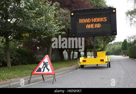 A roadside mobile, solar powered dot-matrix road sign shows the message ...