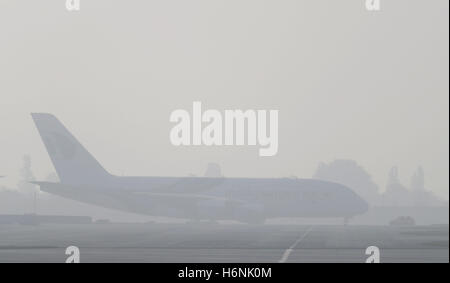 Planes in the fog at Heathrow Airport, as trick-or-treaters can expect ...