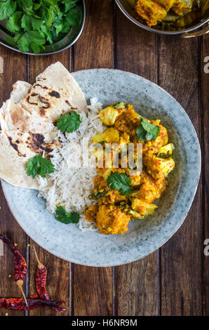 Indian cod curry with basmati rice Stock Photo - Alamy