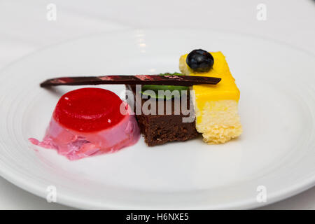 Gourmet desserts on a white plate. Top view Stock Photo - Alamy