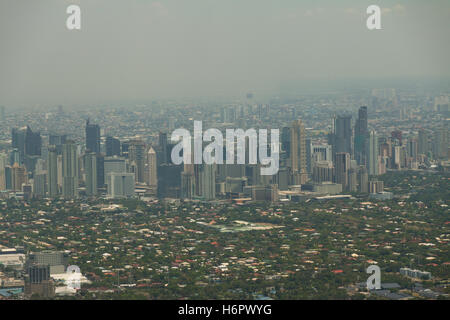 Aerial view of Manila city. Fly over city with skyscrapers and ...