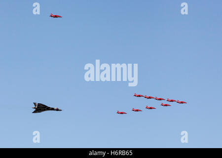 Avro Vulcan bomber and Red Arrows RAF BAe Hawk aircraft in formation at RIAT 2015, Fairford, UK ...