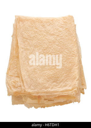 Dried bean curd skin isolated on white background Stock Photo - Alamy