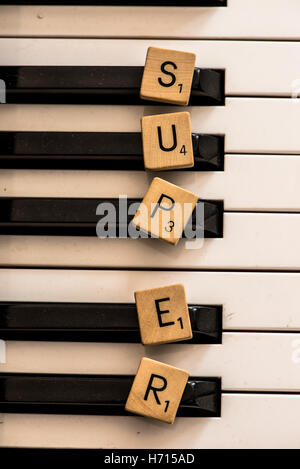 the word super written with wooden letters at piano Stock Photo - Alamy