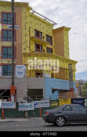 This is a vertical stock image of city construction of a high rise ...