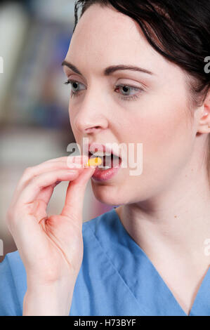 Young female drug addicted social problems sitting at table sniffing ...