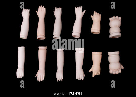 Broken Doll Body Parts Hands and Arms on Black Background Stock Photo ...