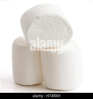 Three marshmallows stacked and isolated on black Stock Photo - Alamy