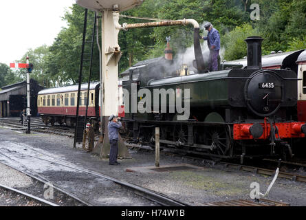 Nostalgia steam engine filling water Stock Photo - Alamy