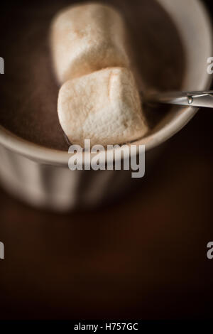 Hot drink with marshmallows on table Stock Photo - Alamy