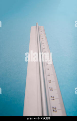 aluminum ruler on blue background. High resolution Stock Photo - Alamy