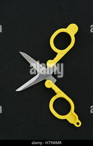 Yellow medical scissors Stock Photo - Alamy