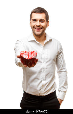 Young man carries heart shaped box Stock Photo - Alamy