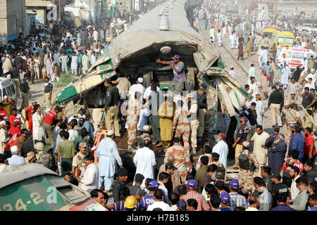 Rescuers work at the site of passenger train that crashed into a goods ...