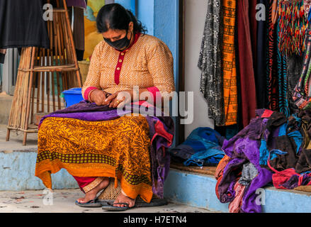 Textile worker in the city of Kathmandu Nepal going about her trade ...