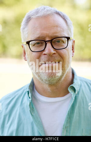 close up of pensioner in eyeglasses looking away Stock Photo - Alamy