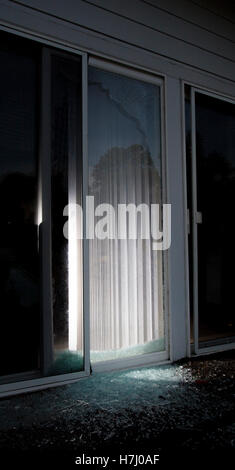 Sliding glass door that has been shattered after a home invasion Stock ...