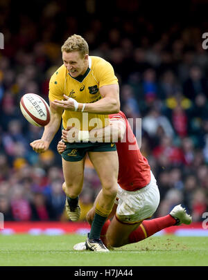 Australia's Reece Hodge (right) is tackled by Fiji's Frank Lomani ...