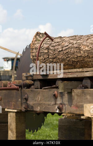Vintage portable log saw working powered by tractor engine Stock Photo ...