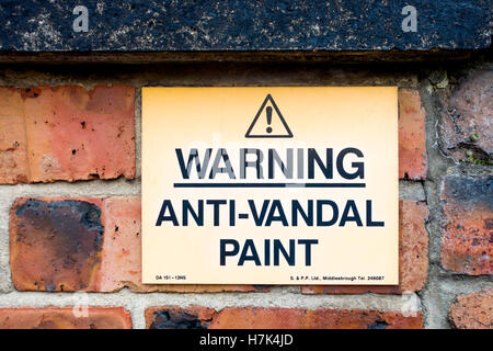 Warning anti vandal paint sign on wall to prevent vandals vandalism on ...