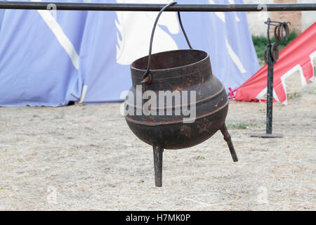 ancient metal cauldron for medieval camp kitchen Stock Photo - Alamy