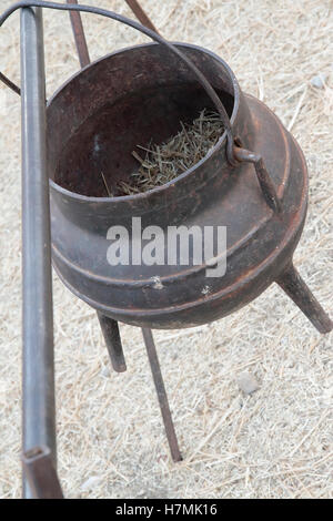 ancient metal cauldron for medieval camp kitchen Stock Photo - Alamy