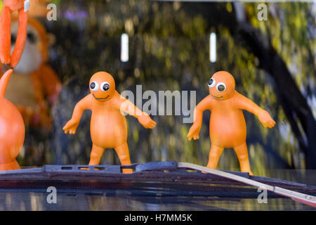 Morph, plastic figures in a window of a car Stock Photo - Alamy