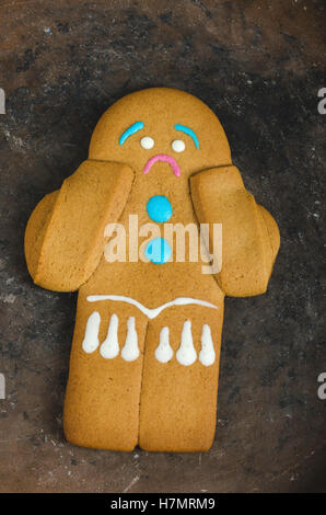 Scared cookie. Homemade gingerbread man biscuit Stock Photo - Alamy