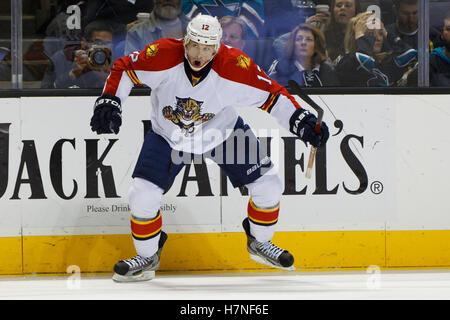 Florida Panthers right wing Jack Devine, center, goe for the puck ...