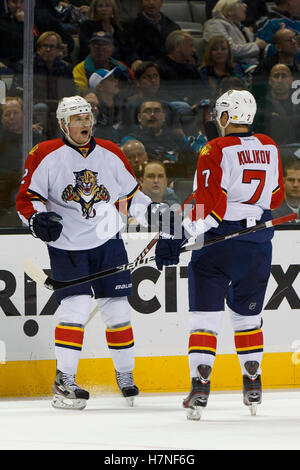 Florida Panthers right wing Jack Devine, center, goe for the puck ...