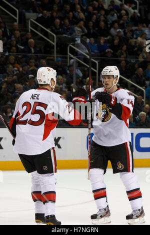 Ottawa Senators' Chris Neil, left, reacts after colliding with Chicago ...