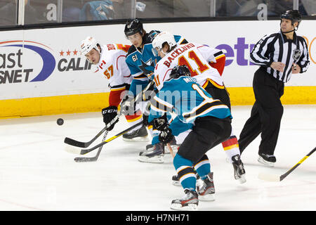 Calgary Flames' Lance Bouma, left, deflects the winning goal past ...