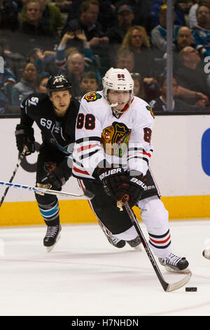Chicago Blackhawks right wing Andrew Shaw, right, controls the puck ...
