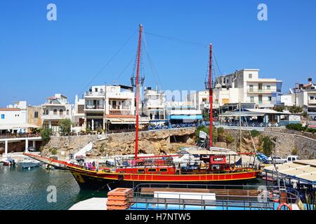 Black Rose Pirate ship moored in the harbour with waterfront ...