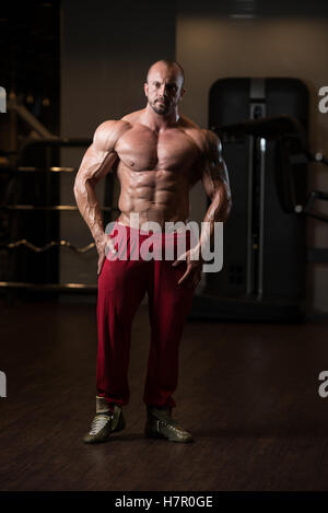 Bodybuilder Posing In Different Poses Demonstrating Their Muscles Stock ...