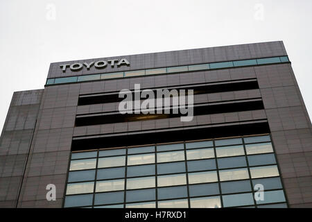 A Toyota Motor Corporation (TMC) signboard on display outside its ...