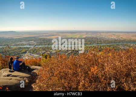 Trekkers at the top of Dieppe cliff on Mont Saint-Hilaire in Quebec ...