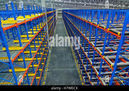Mobile roller racking system in distribution warehouse Stock Photo - Alamy