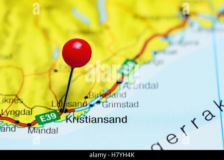 Close up to a Kristiansand city with a red pin needle into Norway ...