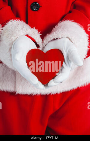 Santa Claus and red heart on a vintage background Stock Photo - Alamy