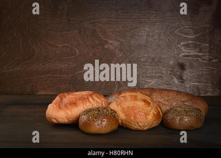 Assortment Of Fresh Artisan Bread Loaves On Floured Wooden Rustic Table ...